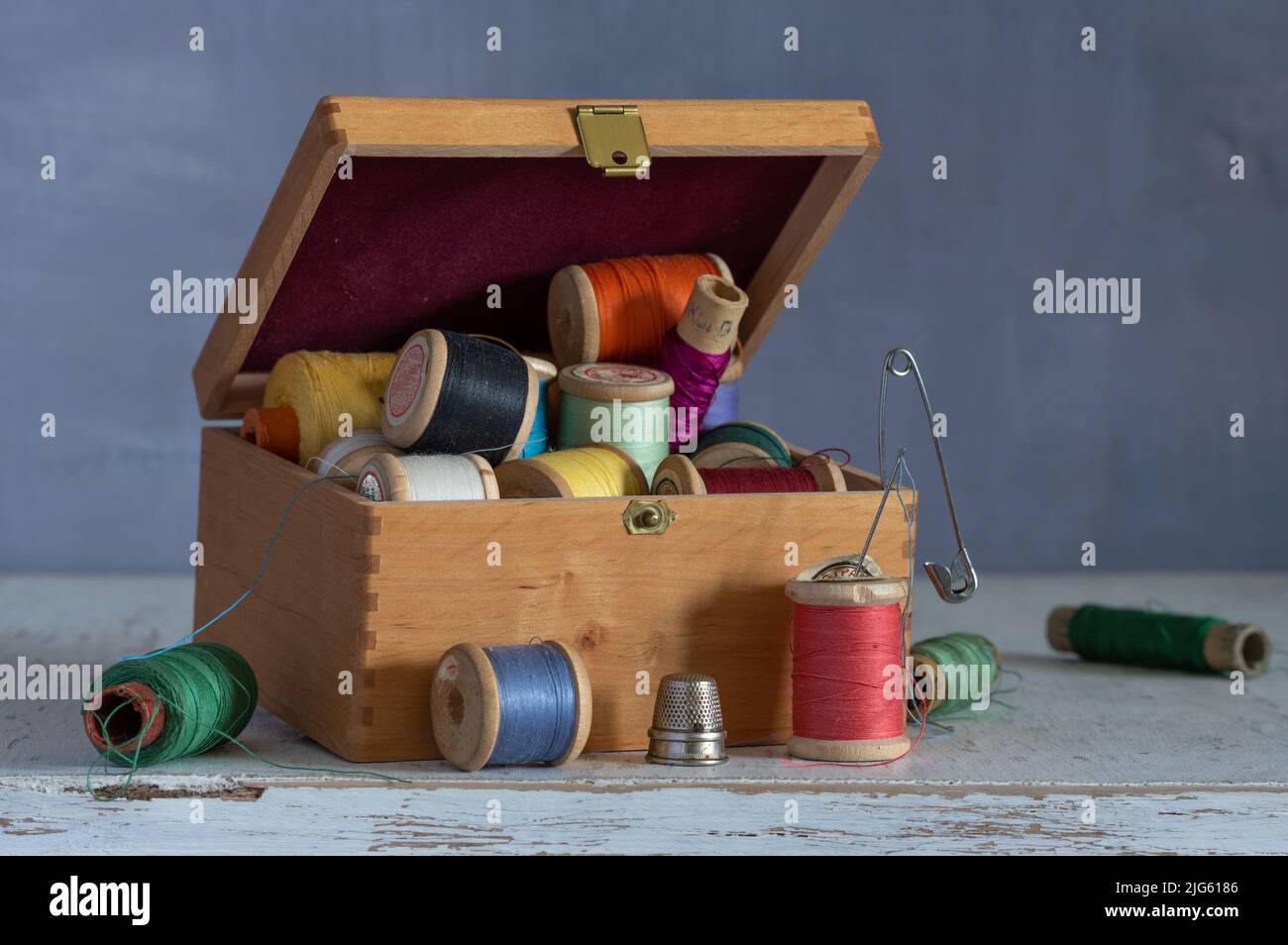 Still life with sewing accessories and a box. Vintage Stock Photo - Alamy