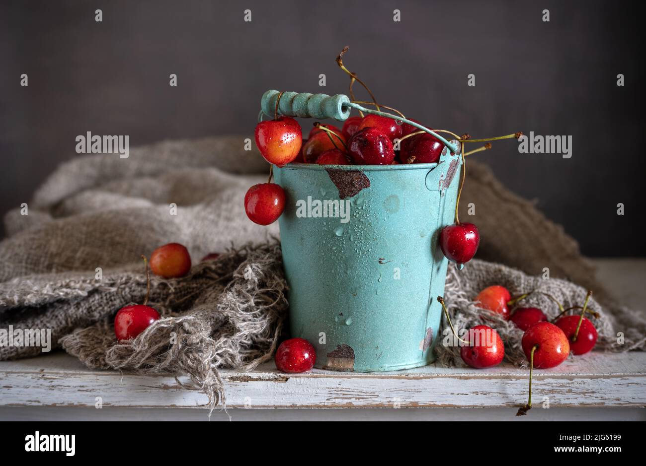 Still life with ripe and tasty cherries in a bucket Stock Photo - Alamy