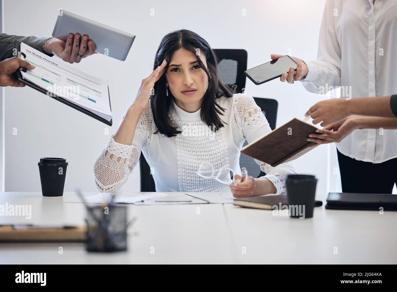 When can I leave. Shot of a young businesswoman looking stressed out in ...