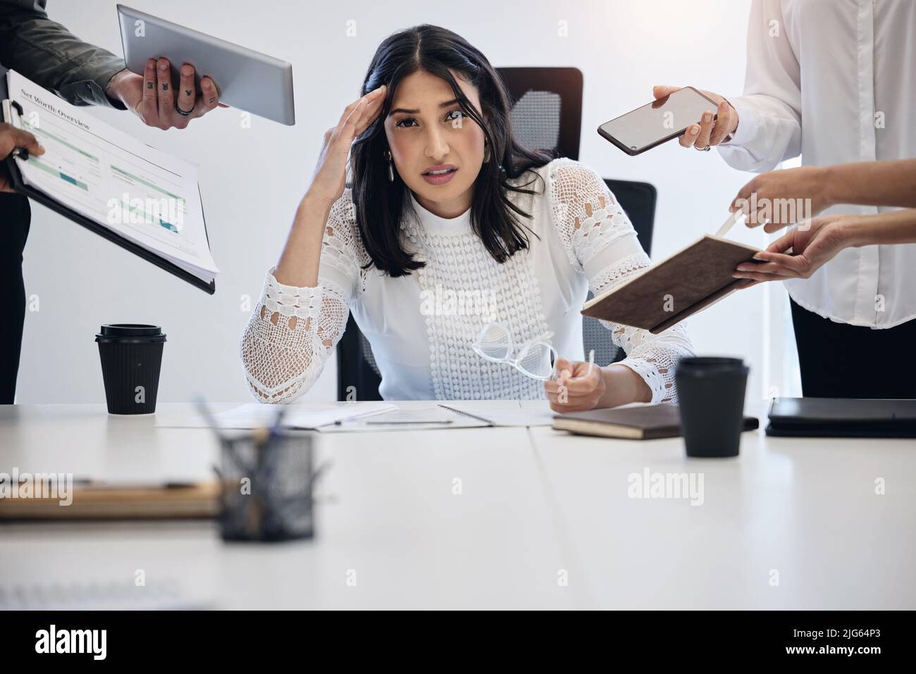 This is too much for one day. Shot of a young businesswoman looking ...