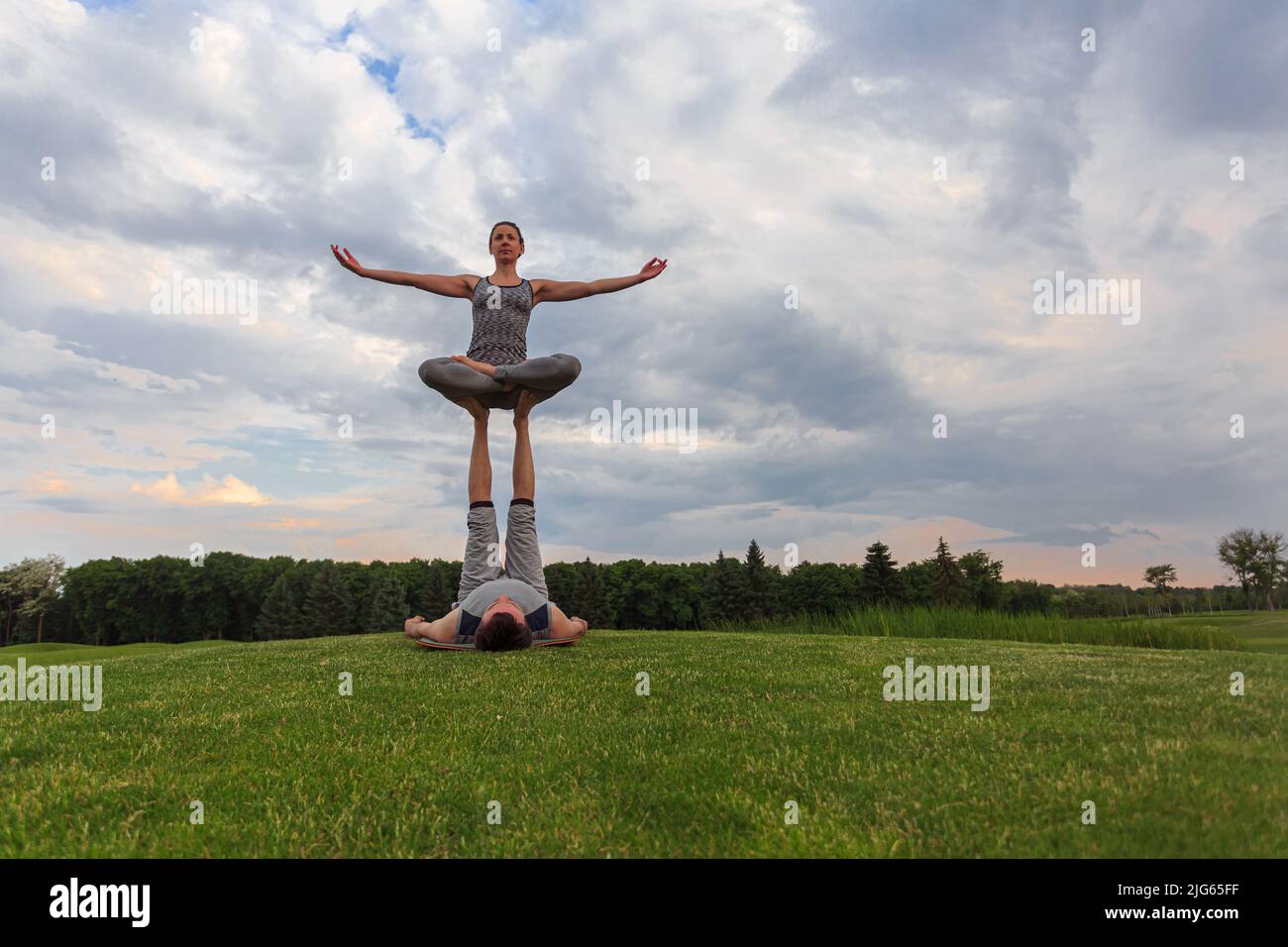 Strong acrobatic woman lifting man hi-res stock photography and images ...