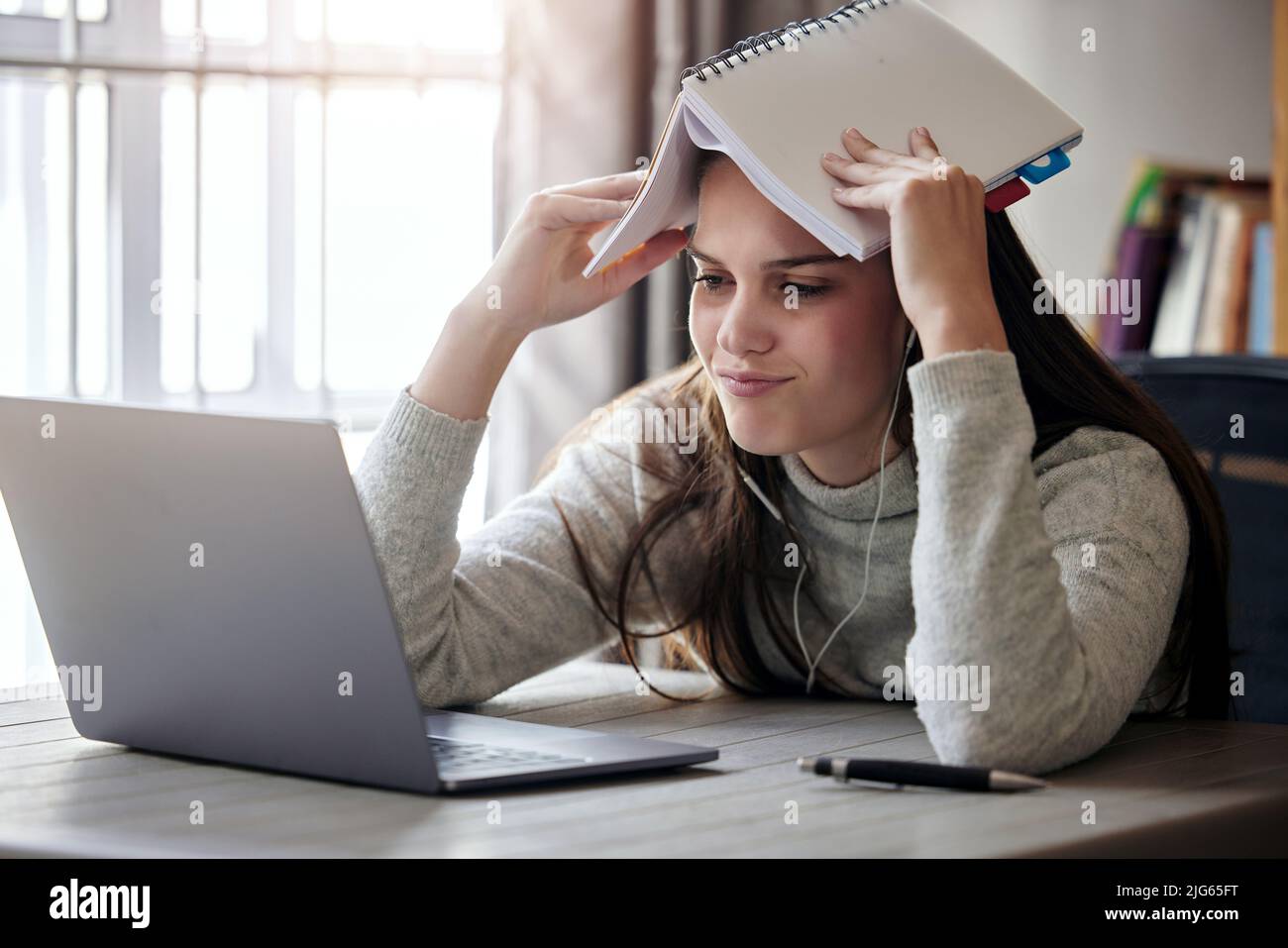 Contemplating my life decisions. Shot of a young businesswoman looking ...