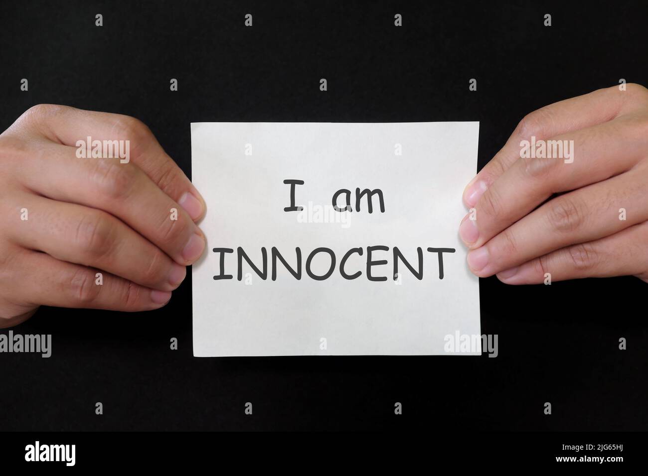Not guilty, innocent and justice miscarriage concept. Hands holding ...