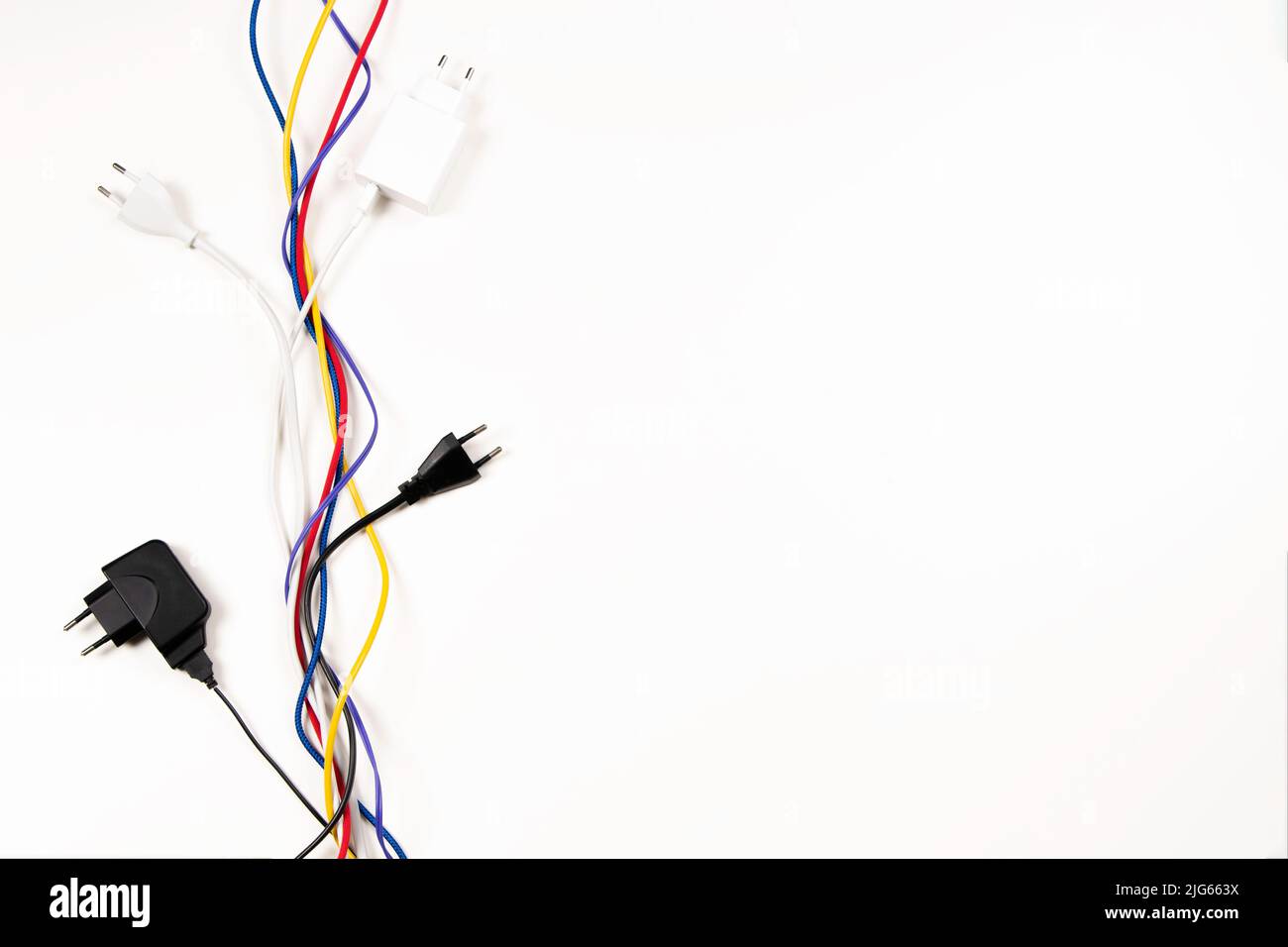 Many colorful electrical cord wires cables cord with plugs twist on ...