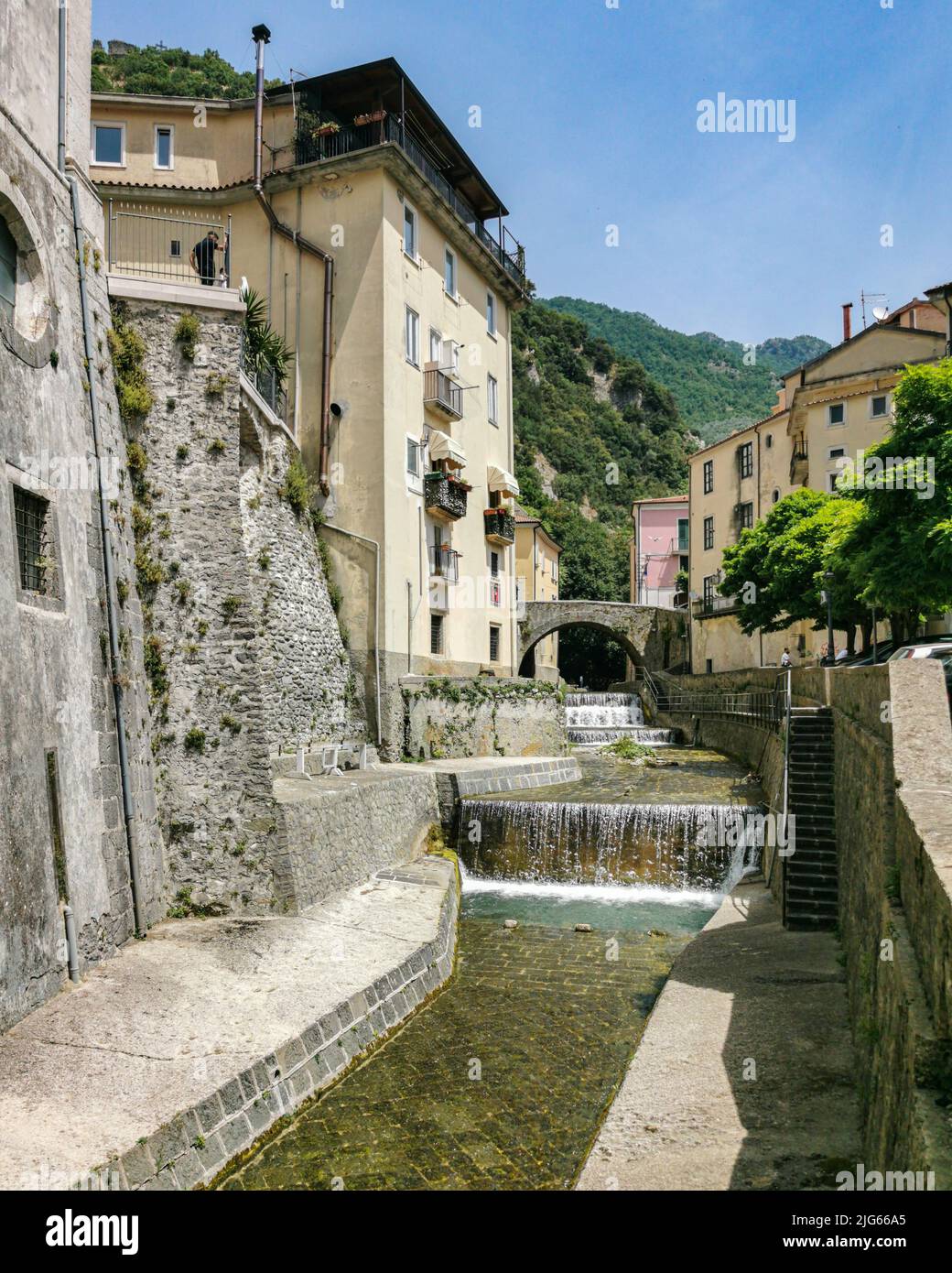 Scenic river with small waterfall crossing the town of Campagna in ...