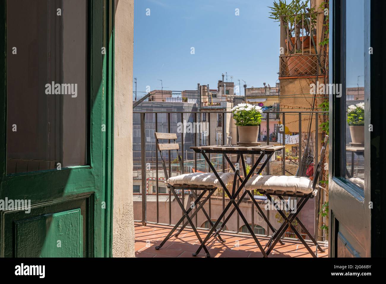 View of Barcelona through open wooden shutters from typical Spanish old ...