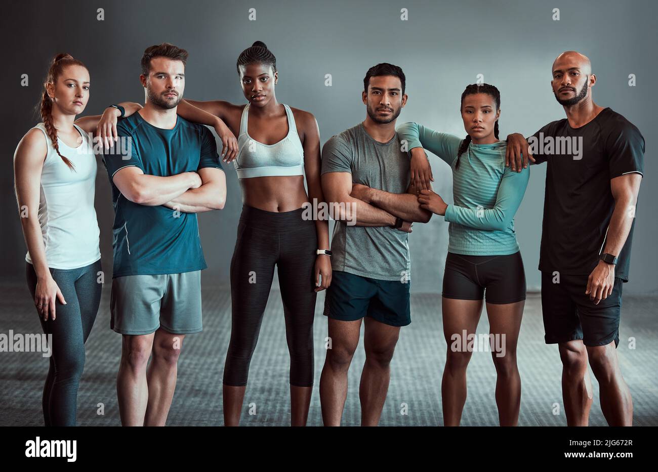 Can you see out muscles. Shot of a group of workout partners together ...