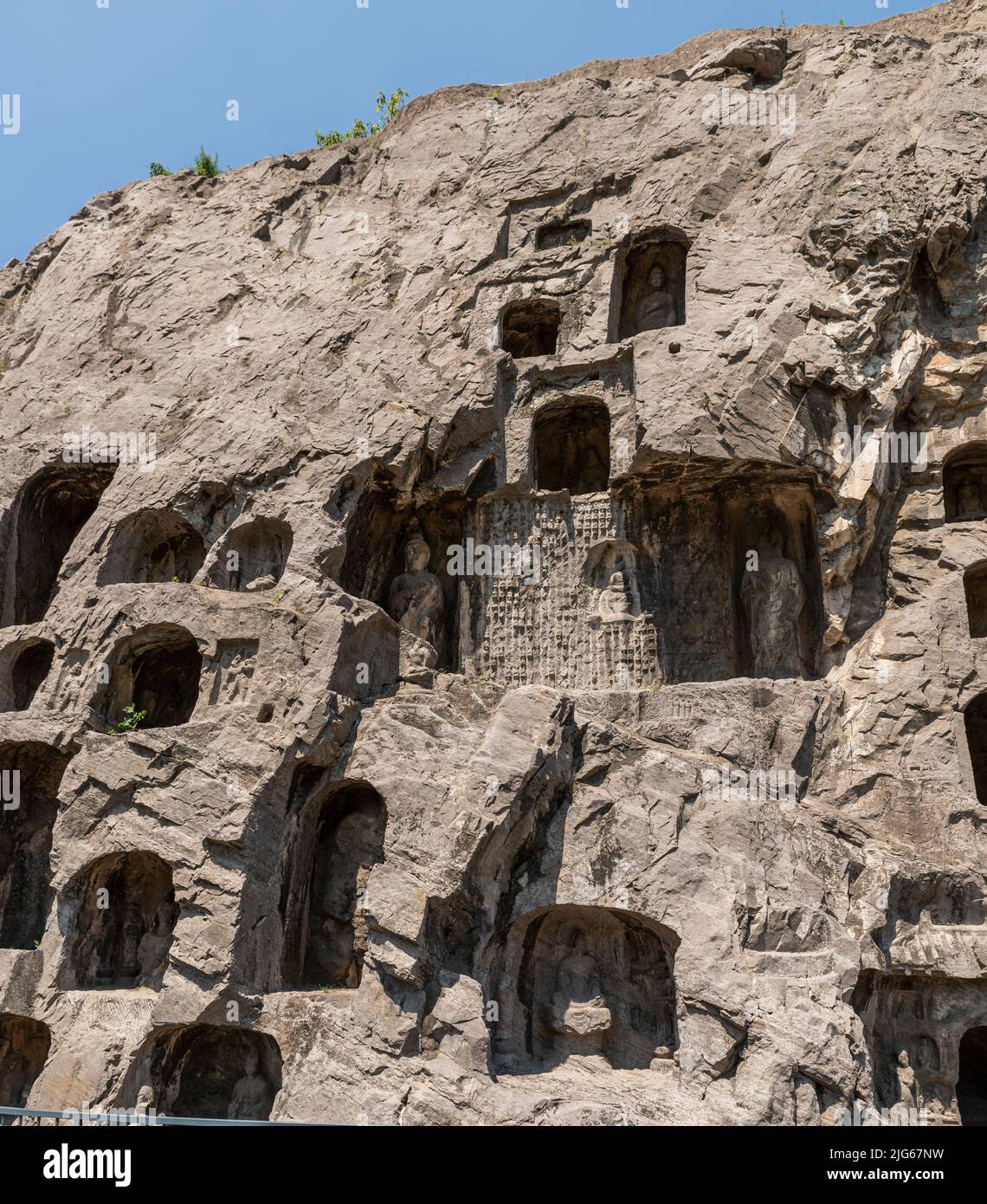 Carved statues of Longmen Grottoes (Longmen Caves). The complex was ...