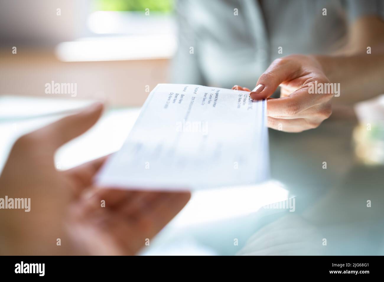Executive Hand Giving Payment Check Or Compensation Cheque Stock Photo ...