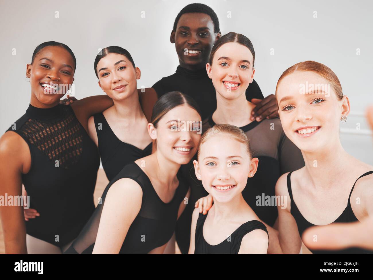 Well give you a good show. Shot of a group of ballet dancers standing ...