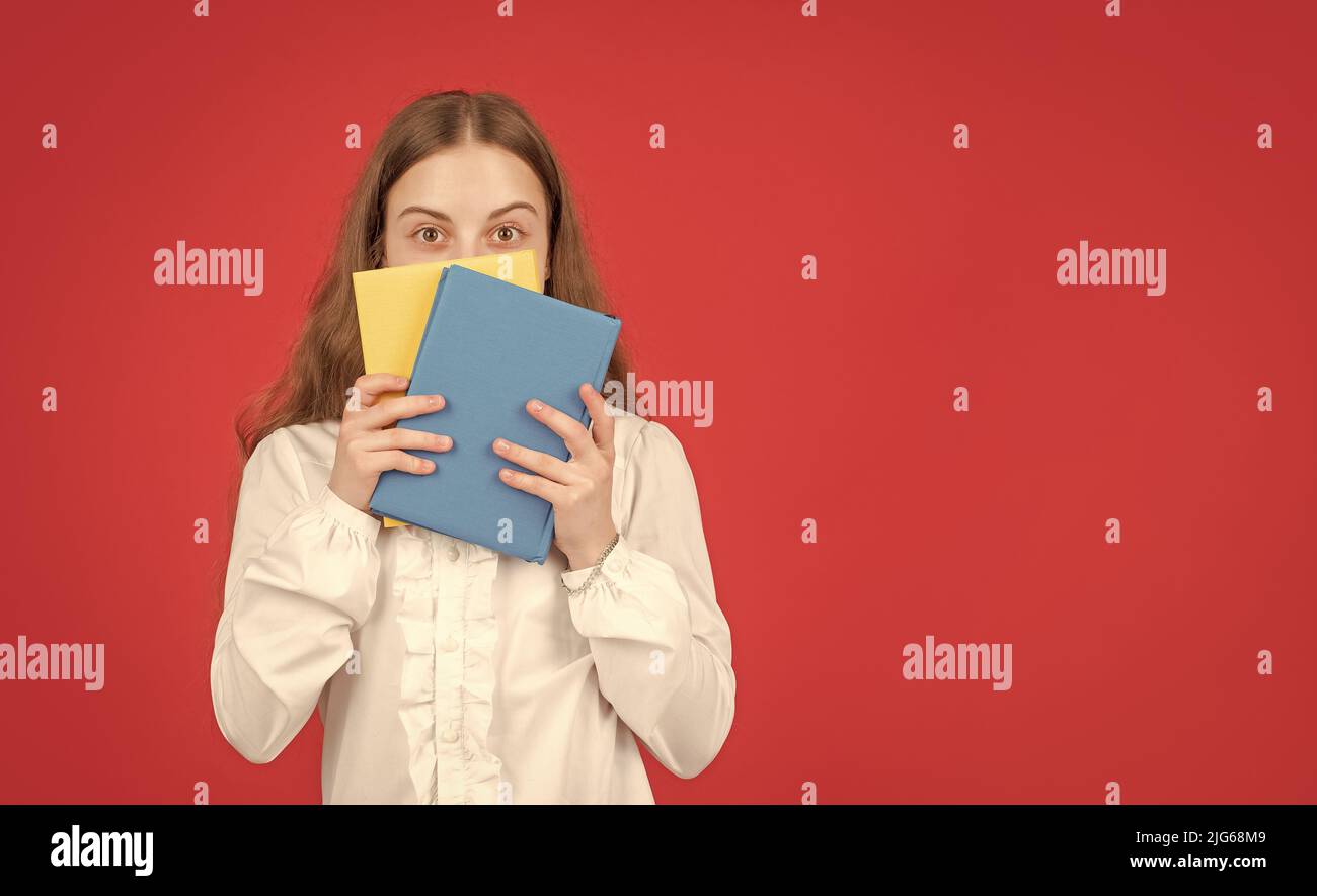 happy childhood. child going to do homework. student behind book Stock ...