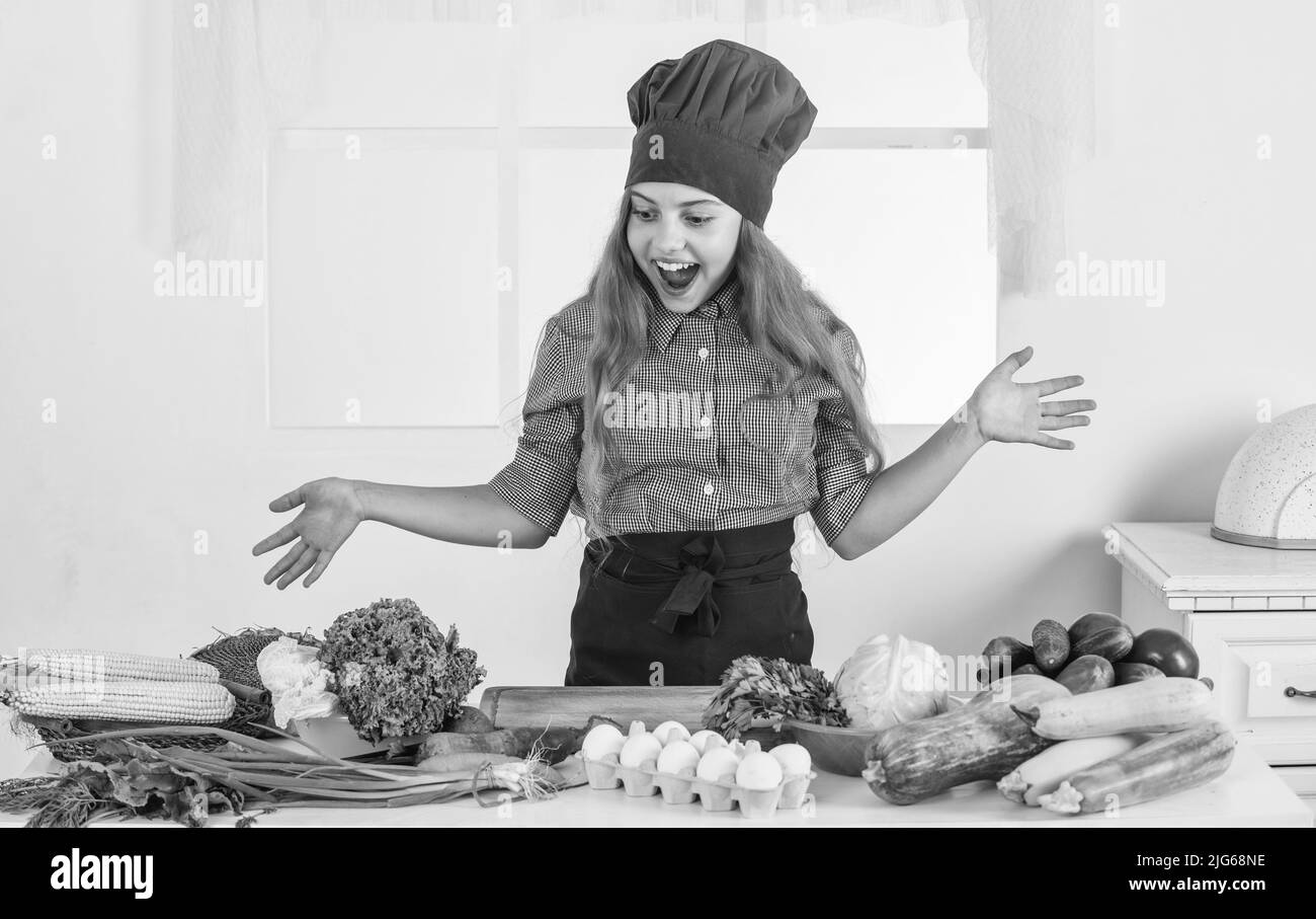 kid having fun with food vegetables at kitchen. Child and vegetables ...