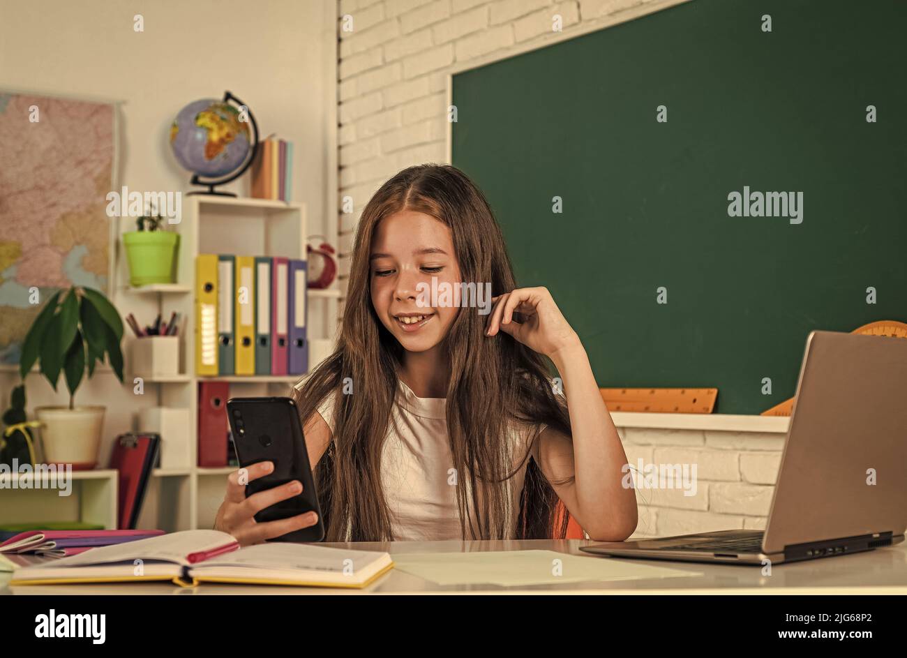 girl in classroom school with smartphone, online education Stock Photo ...