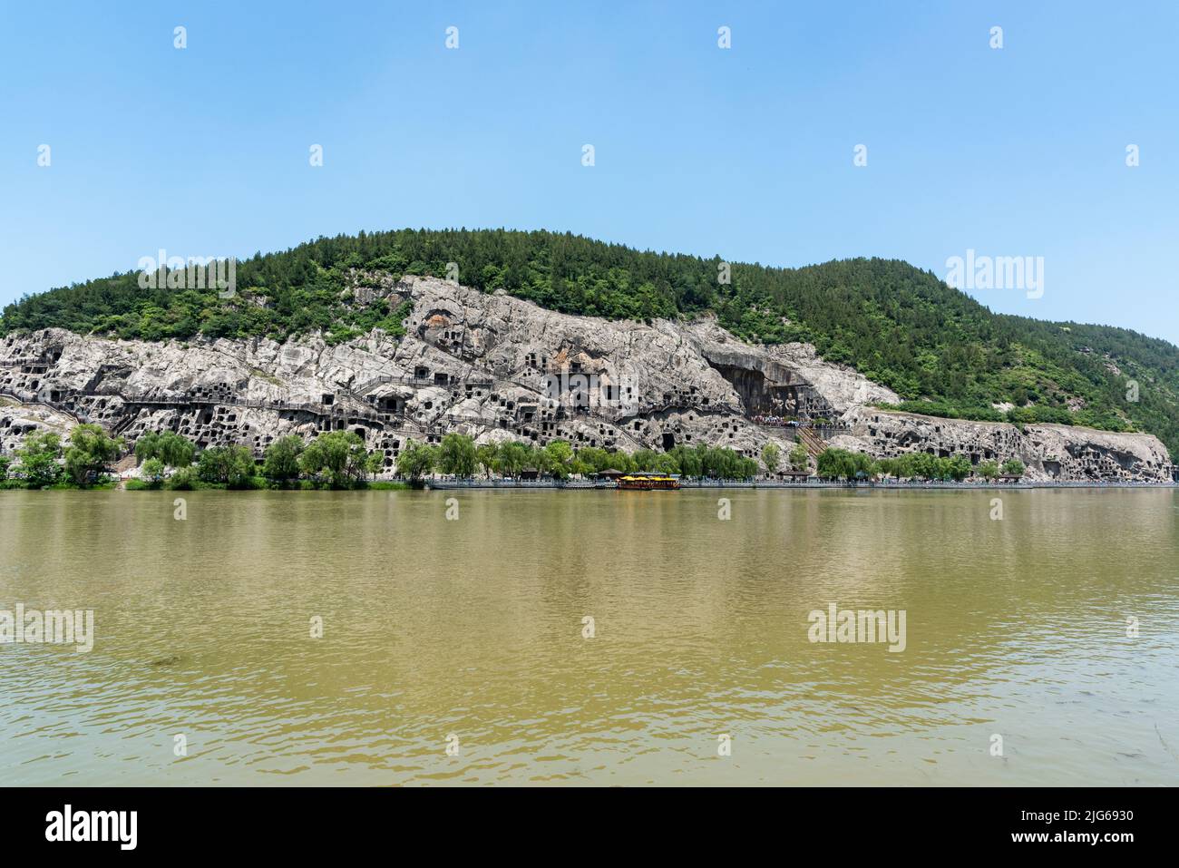 Carved statues of Longmen Grottoes (Longmen Caves). The complex was ...