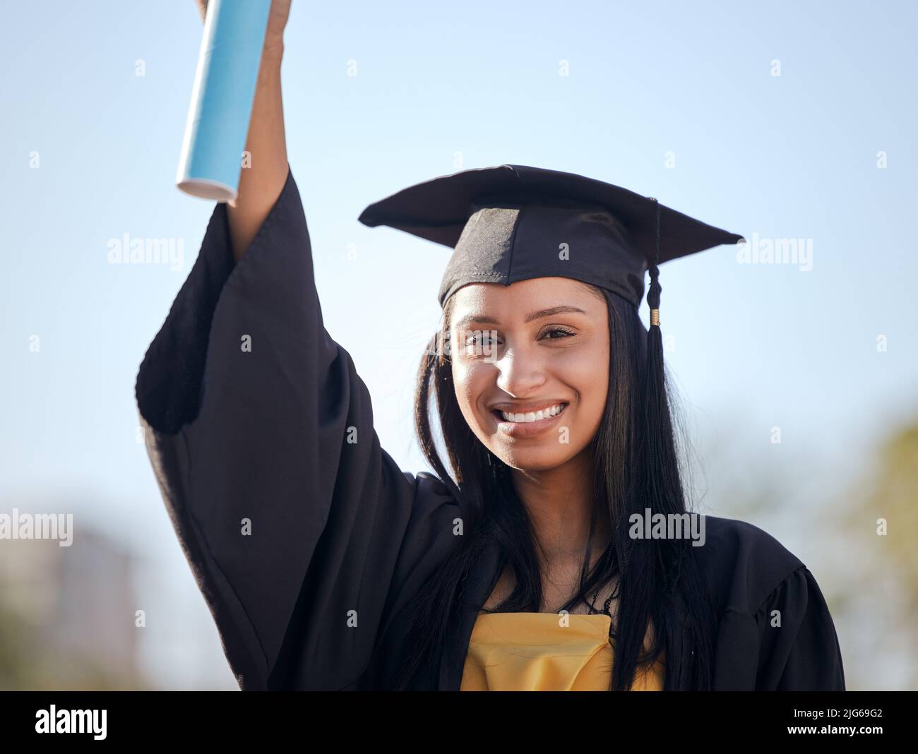 This is what dedication gets you. Portrait of a young woman holding her ...