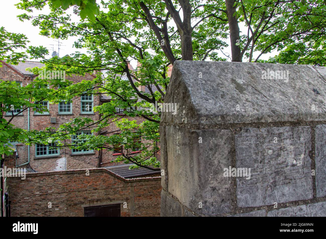 Cityscape view of York, England from atop the medieval city stone walls ...