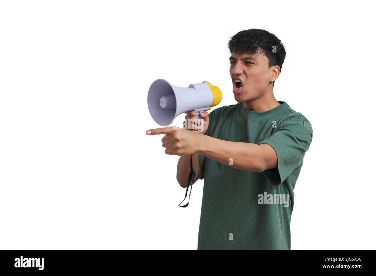 Young peruvian man shouting through megaphone and pointing, isolated ...
