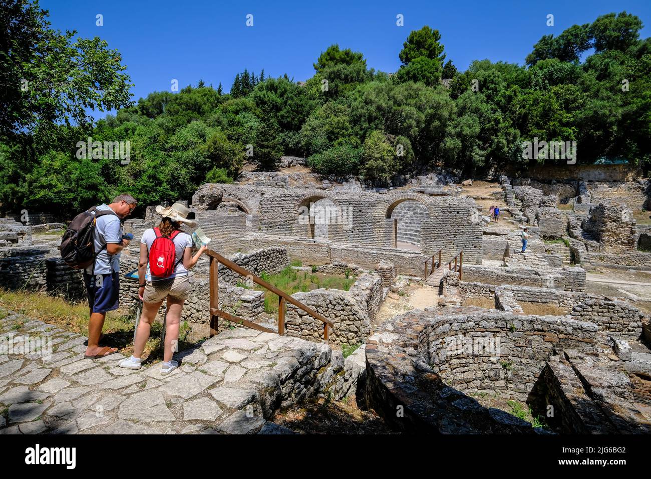 Butrint, Ksamil, Albania - tourists visit the amphitheater in ancient ...