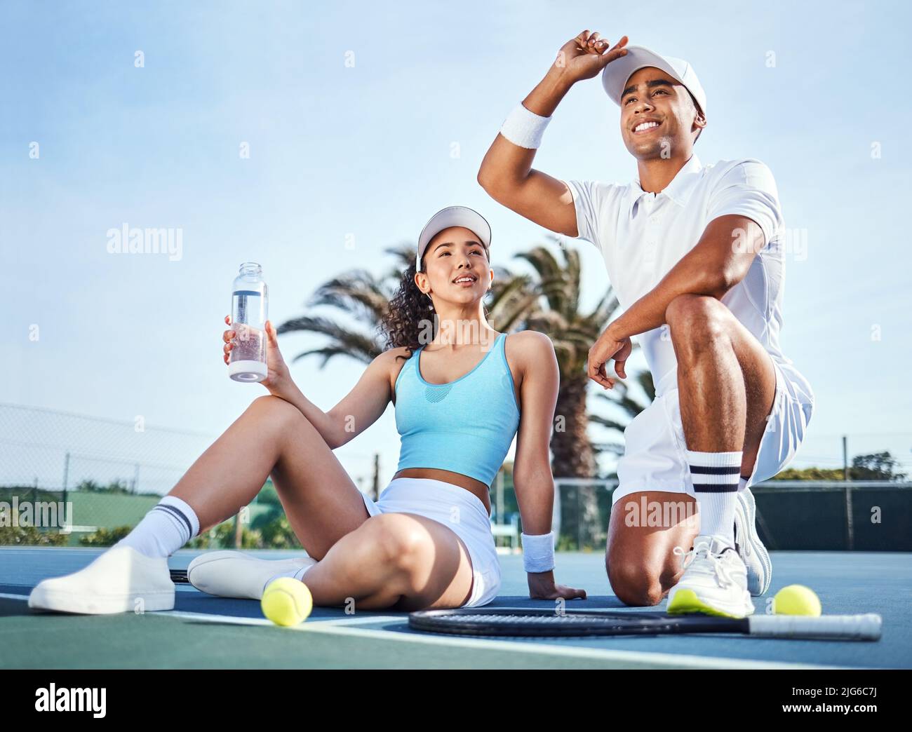 Lets get back out there. Full length shot of two young tennis players ...