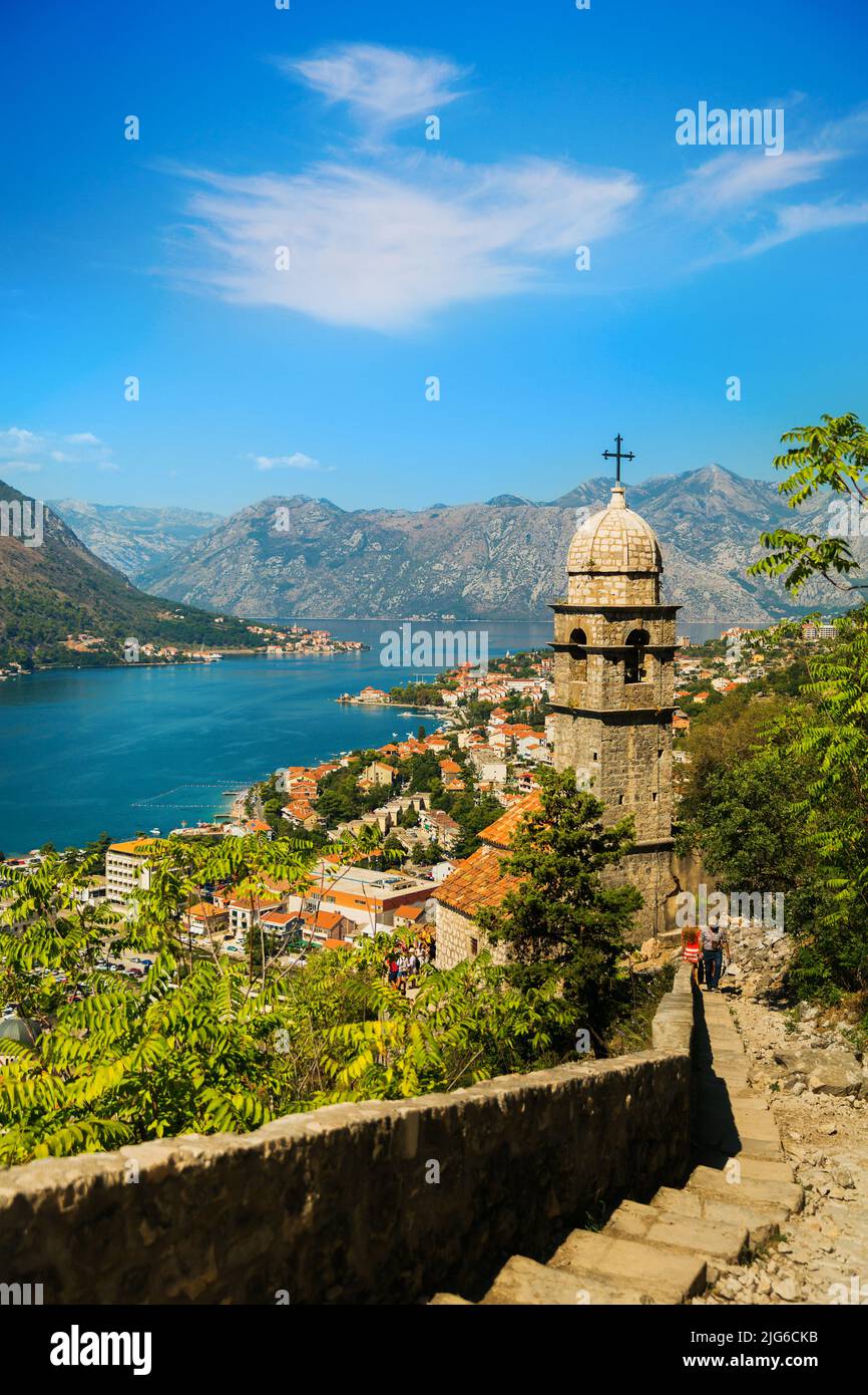 View on Church, ancient walls, mountains and sea in Kotor old town ...