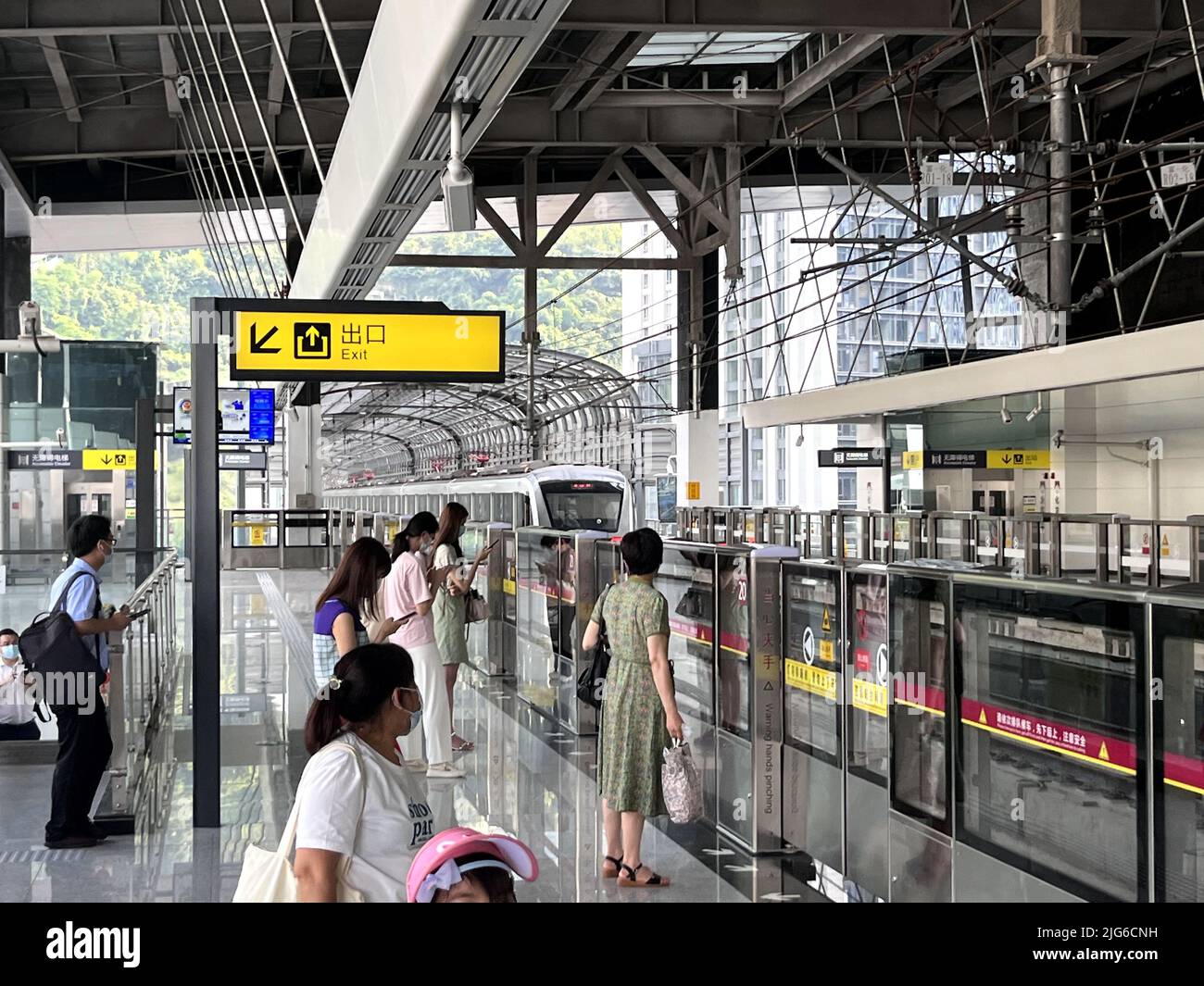 CHONGQING, CHINA - JULY 6, 2022 - A subway train crosses the waist of ...