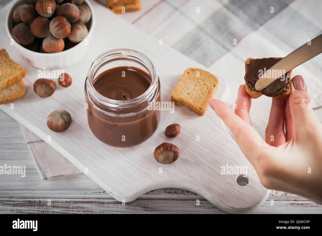 Woman toast chocolate spread hi-res stock photography and images - Alamy
