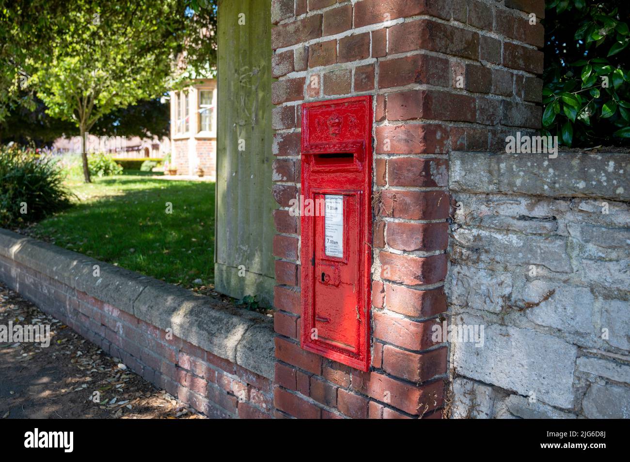 A rare Victorian post box with the initials VR, at Wareham Alms Houses ...
