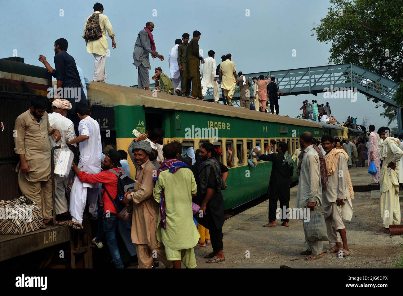 Pakistan, 07/07/2022, Pakistani people boarding on the roof top of a ...