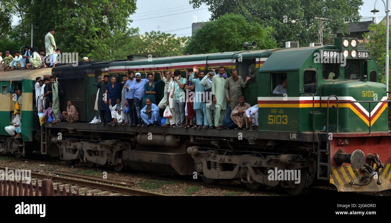 Pakistan, 07/07/2022, Pakistani people boarding on the roof top of a ...