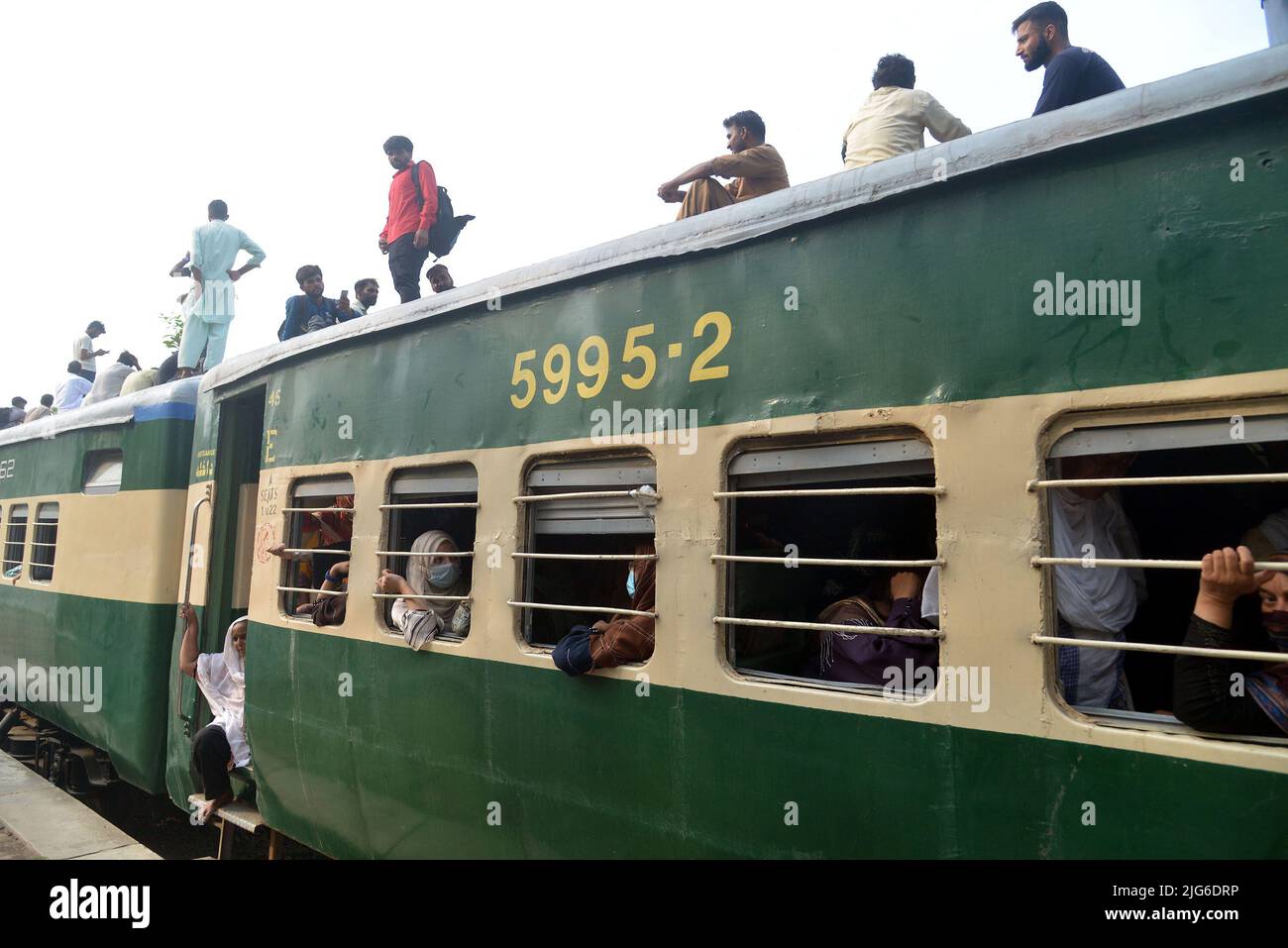 Pakistan, 07/07/2022, Pakistani people boarding on the roof top of a ...