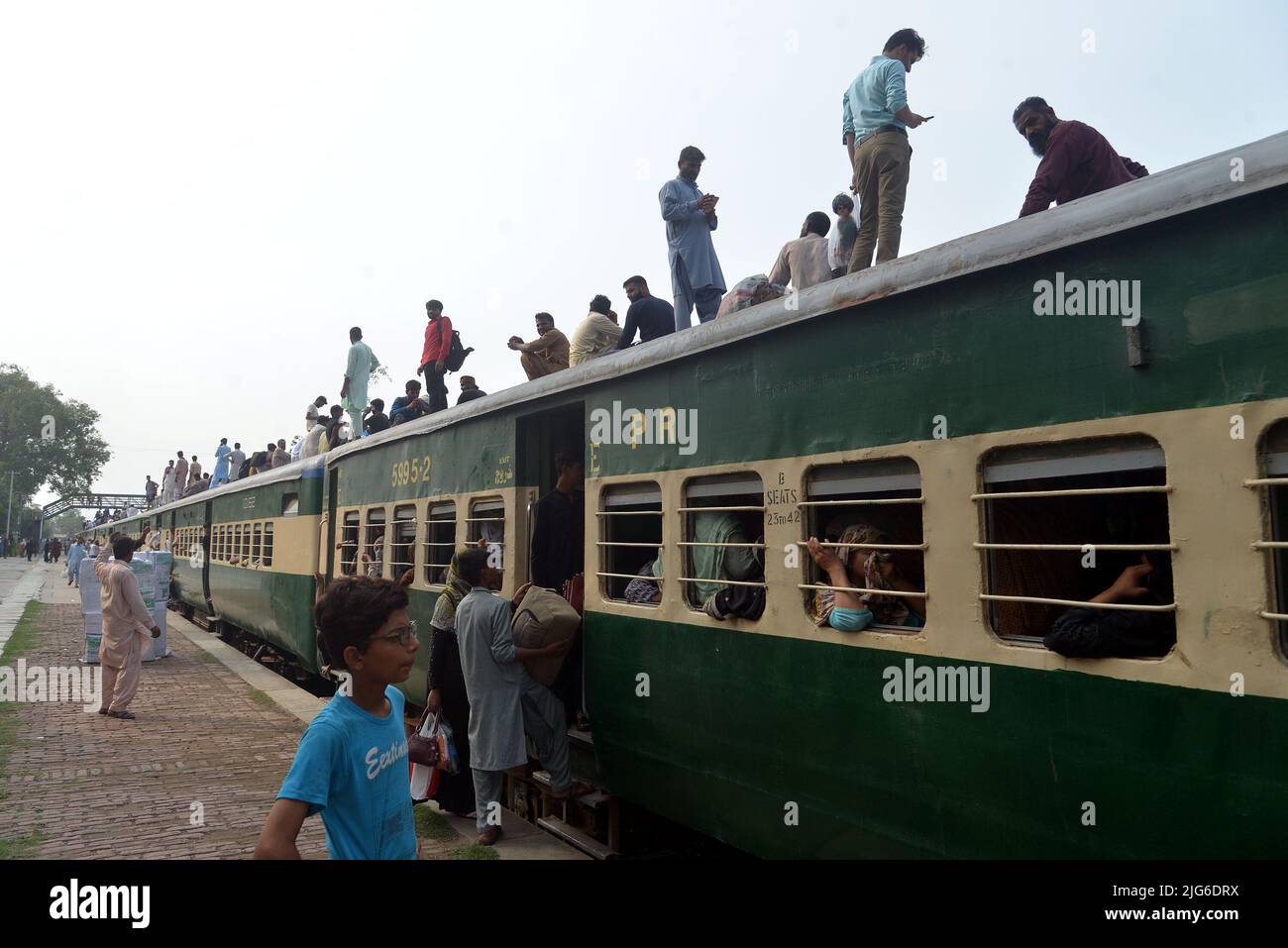 Pakistan, 07/07/2022, Pakistani people boarding on the roof top of a ...