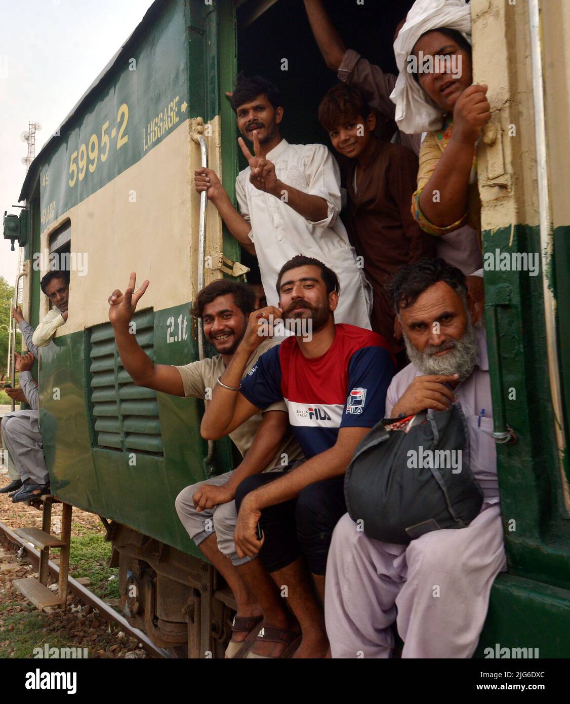 Pakistan, 07/07/2022, Pakistani people boarding on the roof top of a ...
