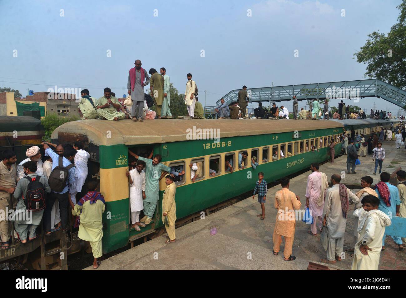 Pakistan, 07/07/2022, Pakistani people boarding on the roof top of a ...