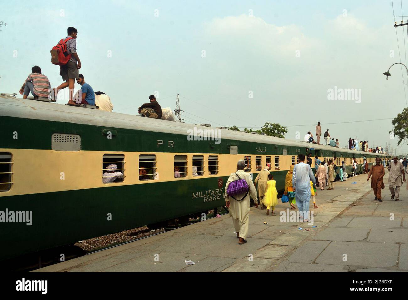 Pakistan, 07/07/2022, Pakistani people boarding on the roof top of a ...
