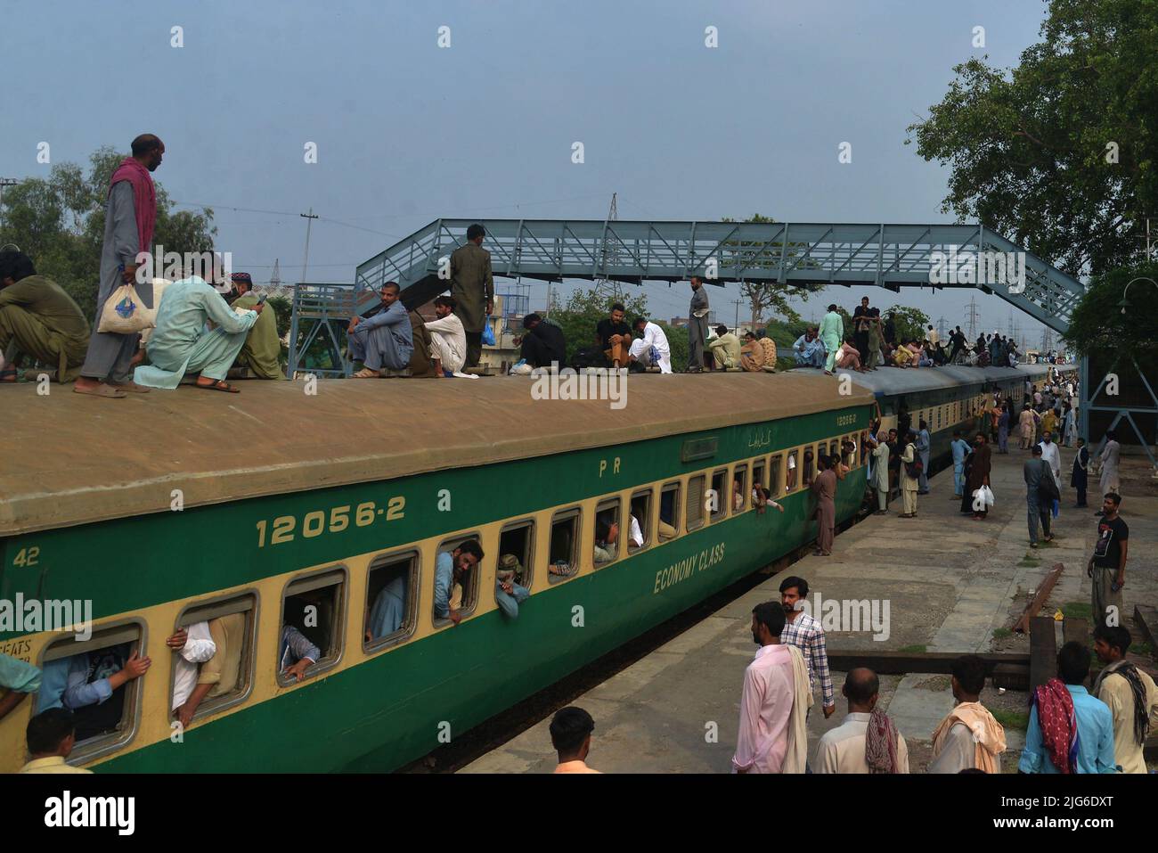 Pakistan, 07/07/2022, Pakistani people boarding on the roof top of a ...