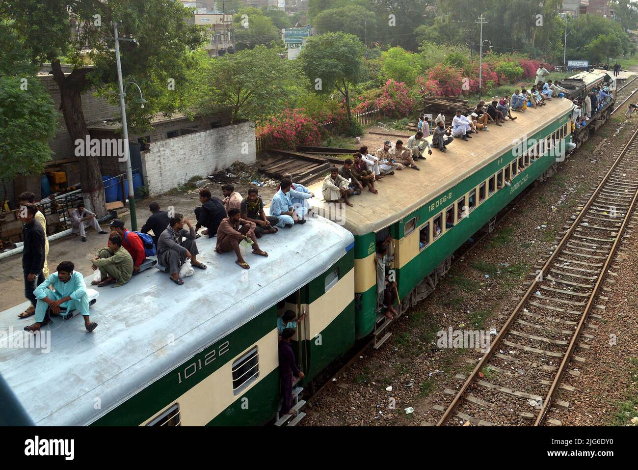Pakistan, 07/07/2022, Pakistani people boarding on the roof top of a ...