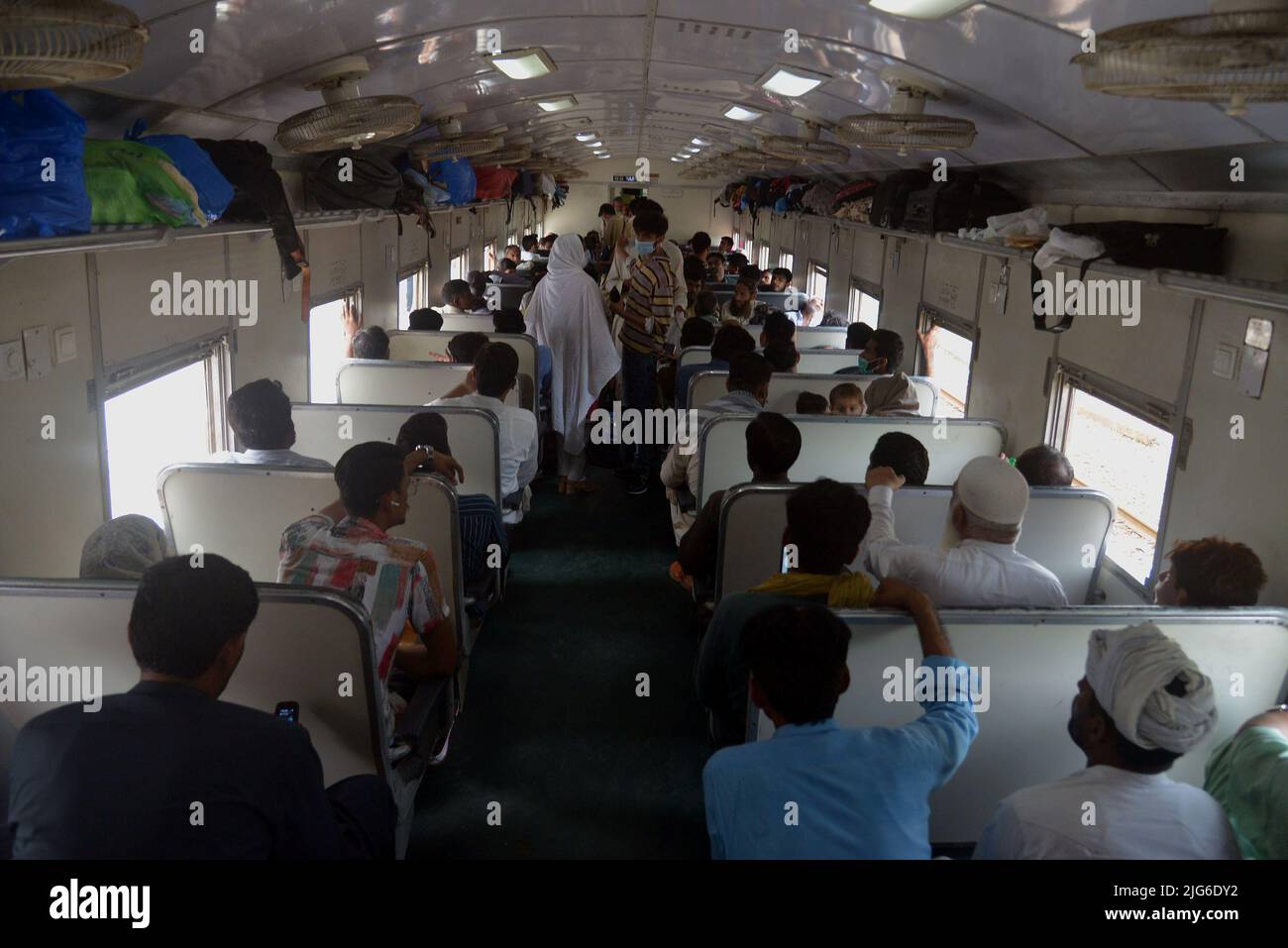 Pakistan, 07/07/2022, Pakistani people boarding on the roof top of a ...