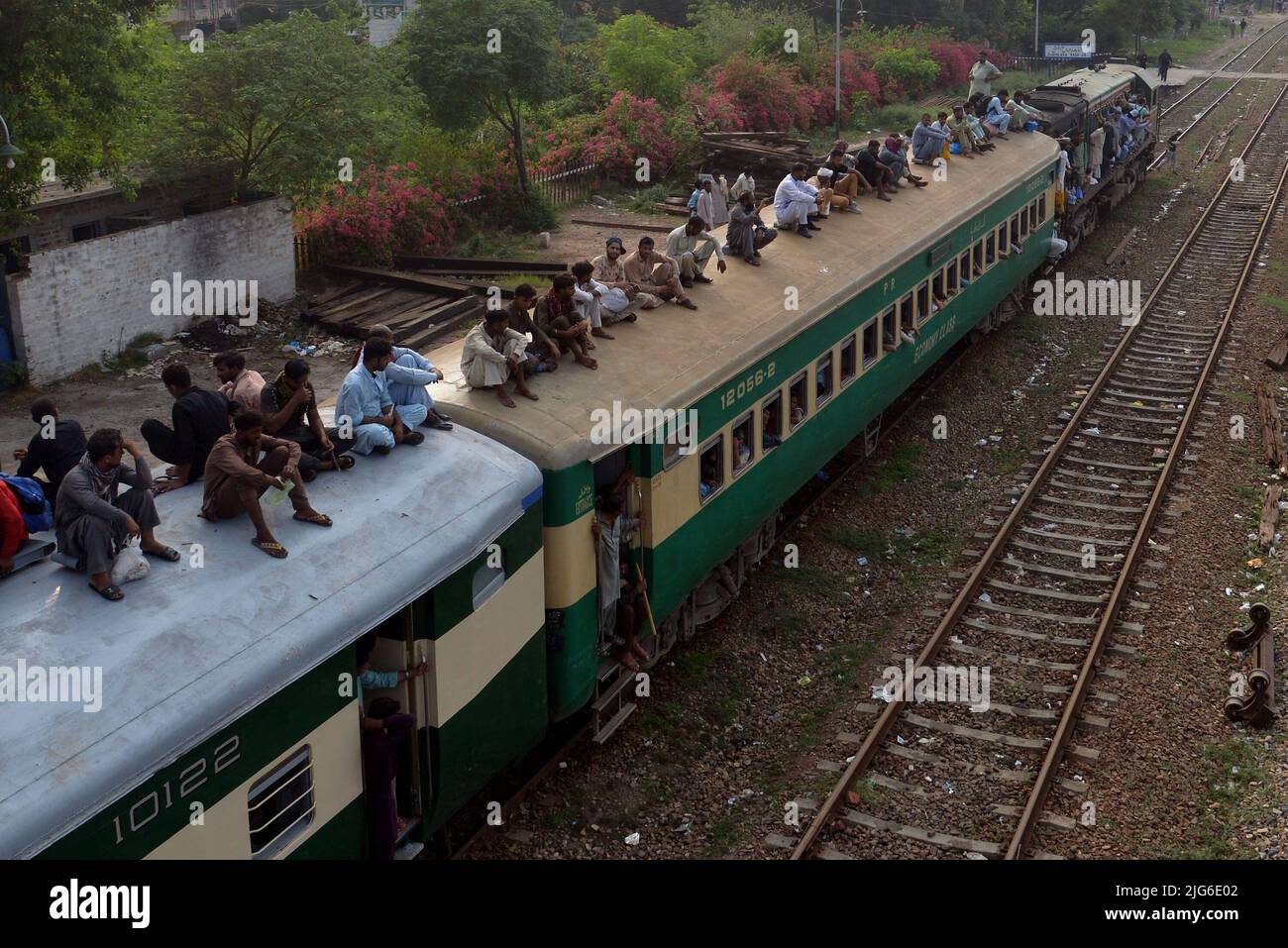 Pakistan, 07/07/2022, Pakistani people boarding on the roof top of a ...