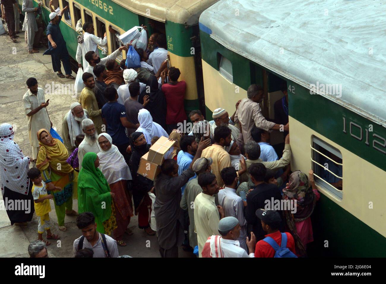 Pakistan, 07/07/2022, Pakistani people boarding on the roof top of a ...