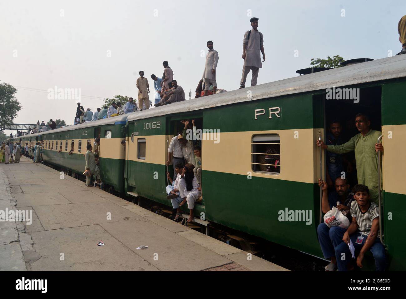 Pakistan, 07/07/2022, Pakistani people boarding on the roof top of a ...