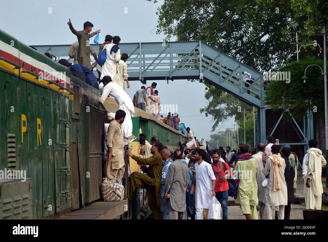Pakistan, 07/07/2022, Pakistani people boarding on the roof top of a ...