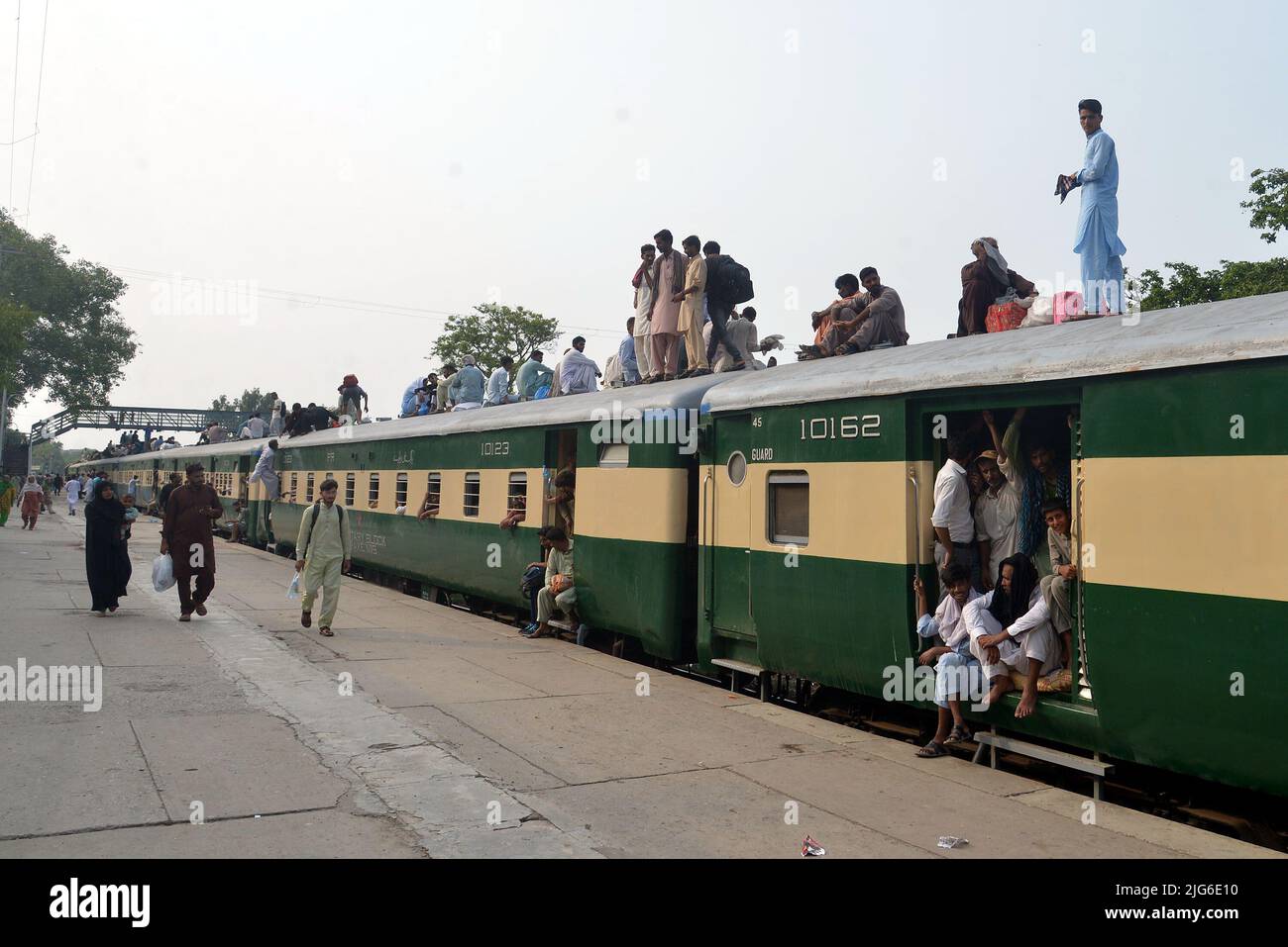 Pakistan, 07/07/2022, Pakistani people boarding on the roof top of a ...