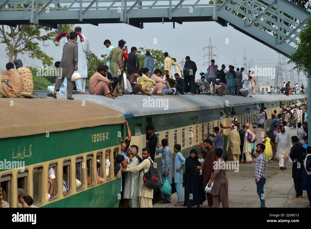 Pakistan, 07/07/2022, Pakistani people boarding on the roof top of a ...