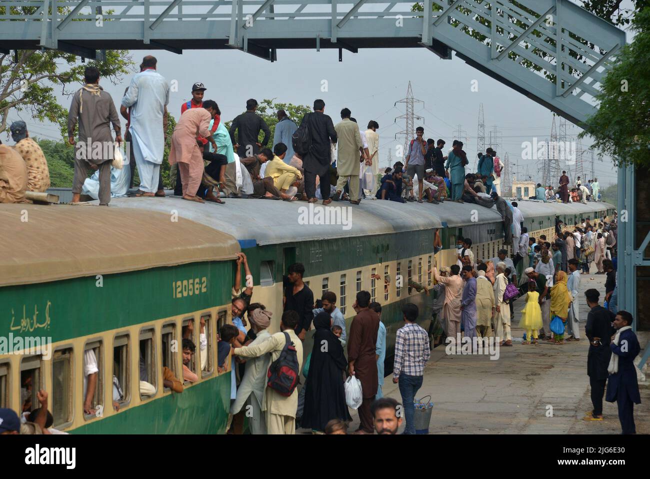 Pakistan, 07/07/2022, Pakistani people boarding on the roof top of a ...