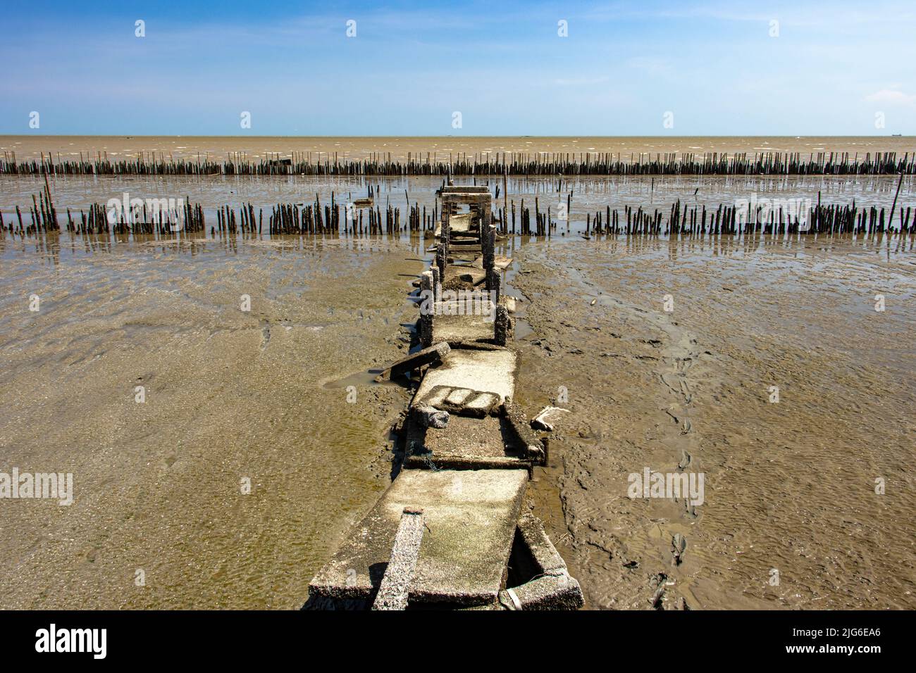 A demolished concrete trail on a pillars at the end of the way with ...