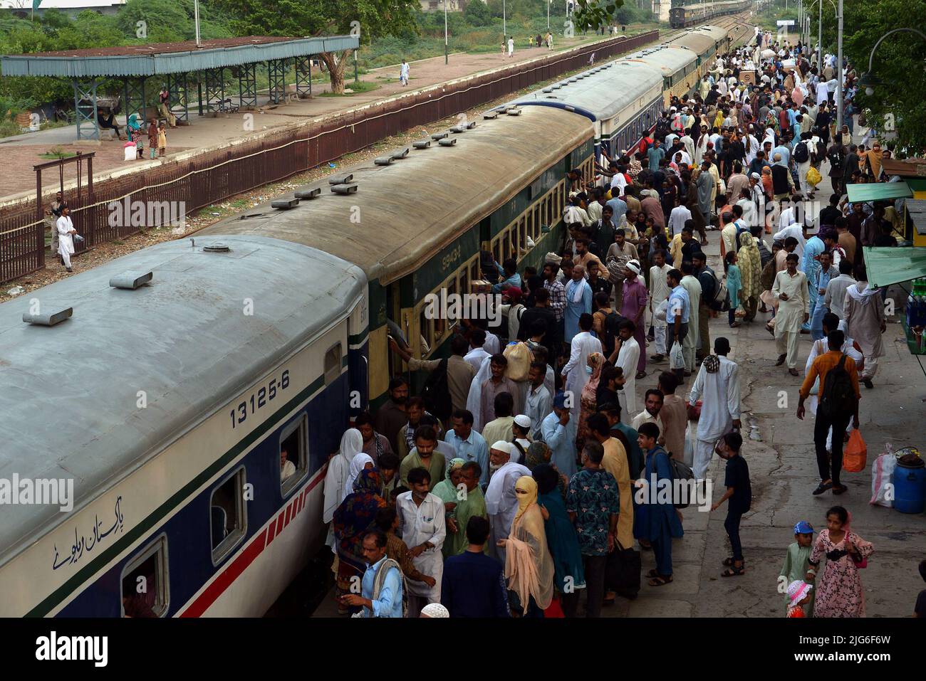 Lahore, Punjab, Pakistan: July 7, 2022, Pakistani people boarding on ...