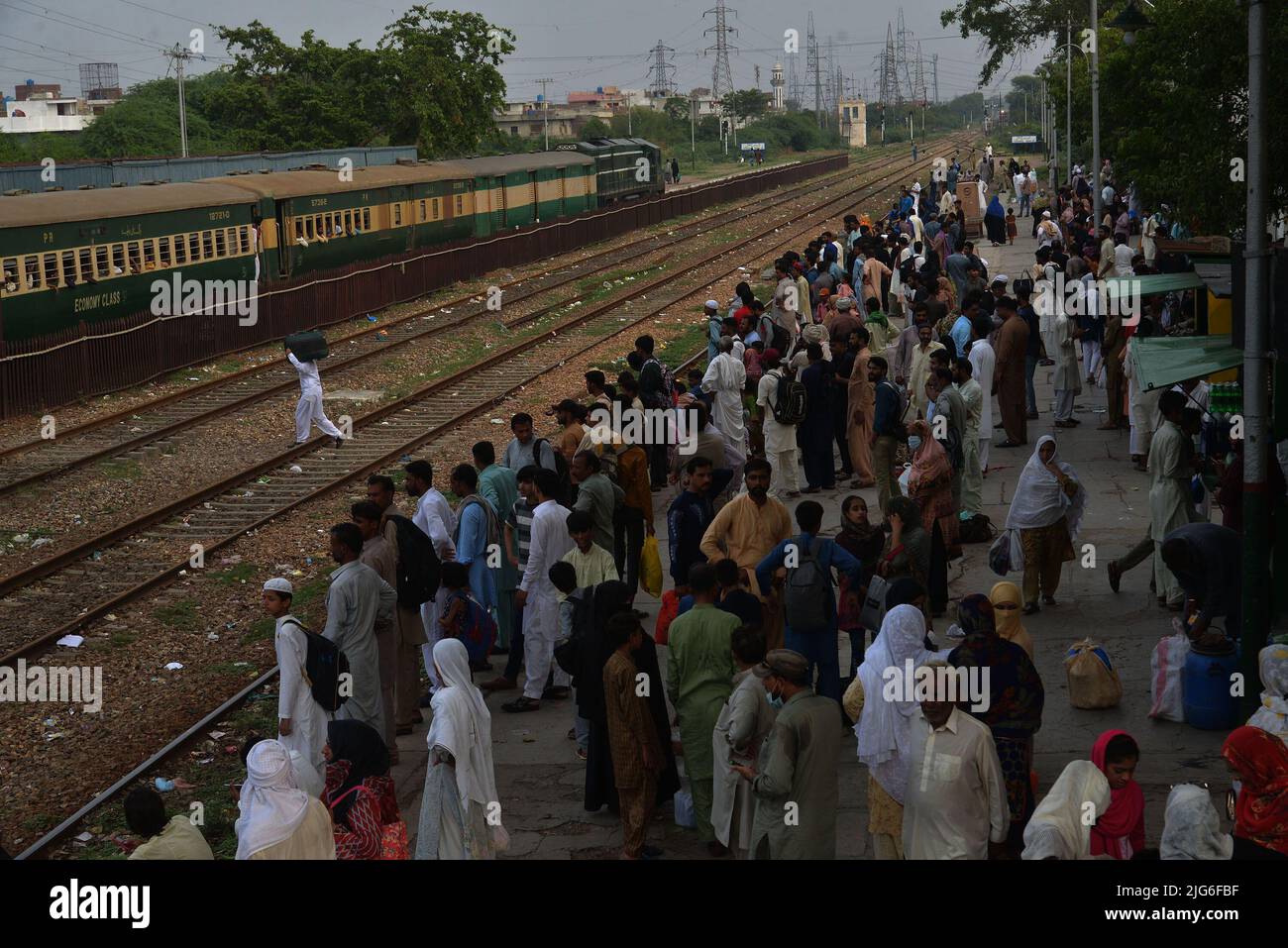 Lahore, Punjab, Pakistan: July 7, 2022, Pakistani people boarding on ...