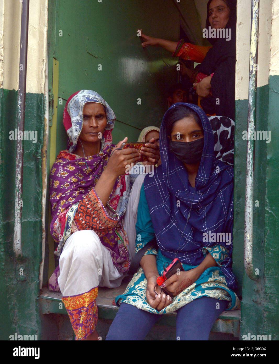 Lahore, Punjab, Pakistan: July 7, 2022, Pakistani people boarding on ...