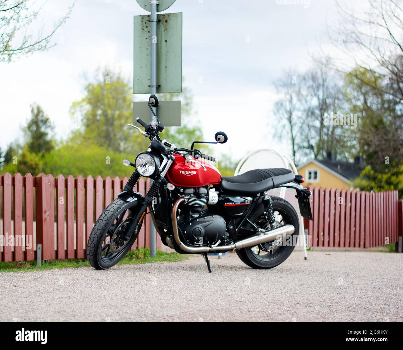 Red motorcycle at the local farm Stock Photo - Alamy