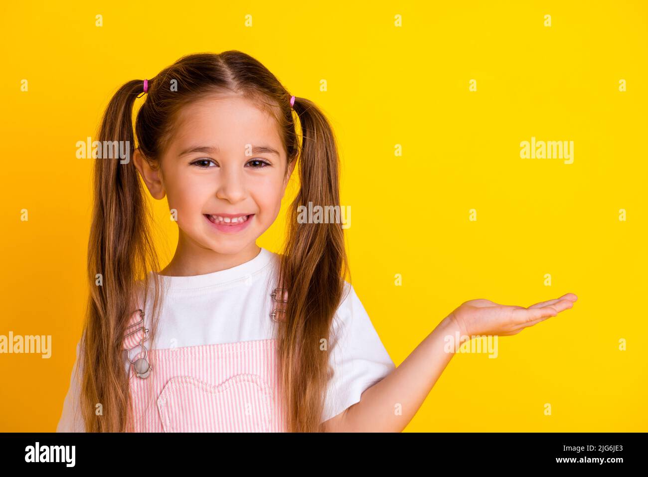 Photo of sweet adorable preschool lady dressed pink clothes holding arm ...
